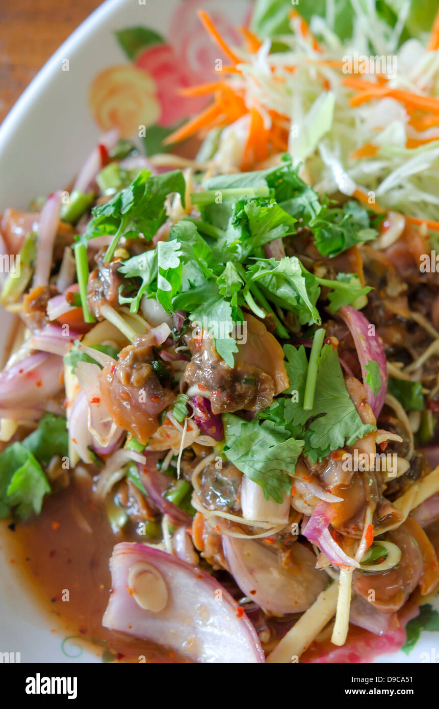 top view spicy cockles salad served with fresh vegetable on dish Stock ...