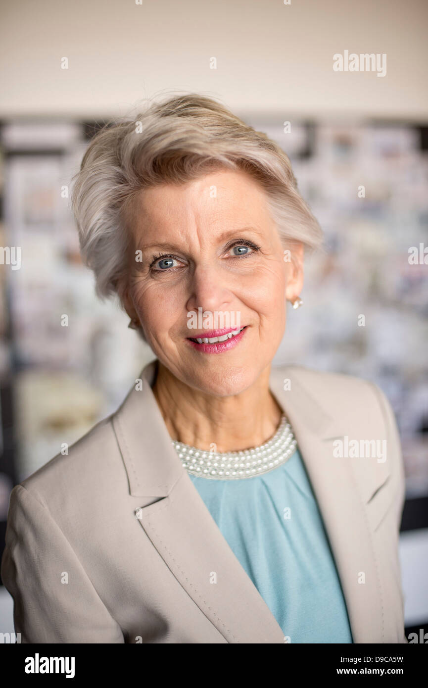 Smiling woman wearing beige hi-res stock photography and images - Alamy