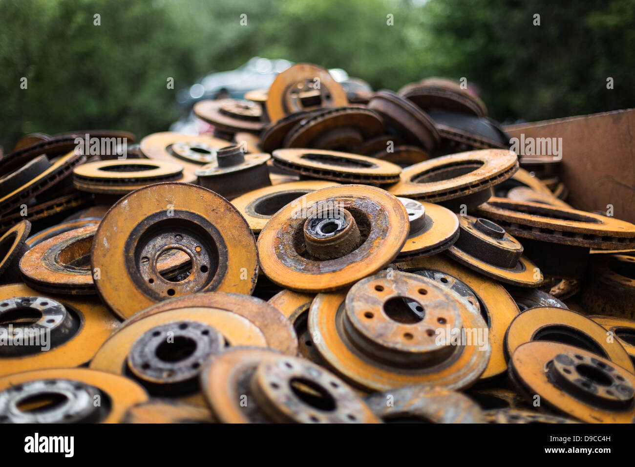 A pile of rusty brake disks at a scrap yard Stock Photo - Alamy