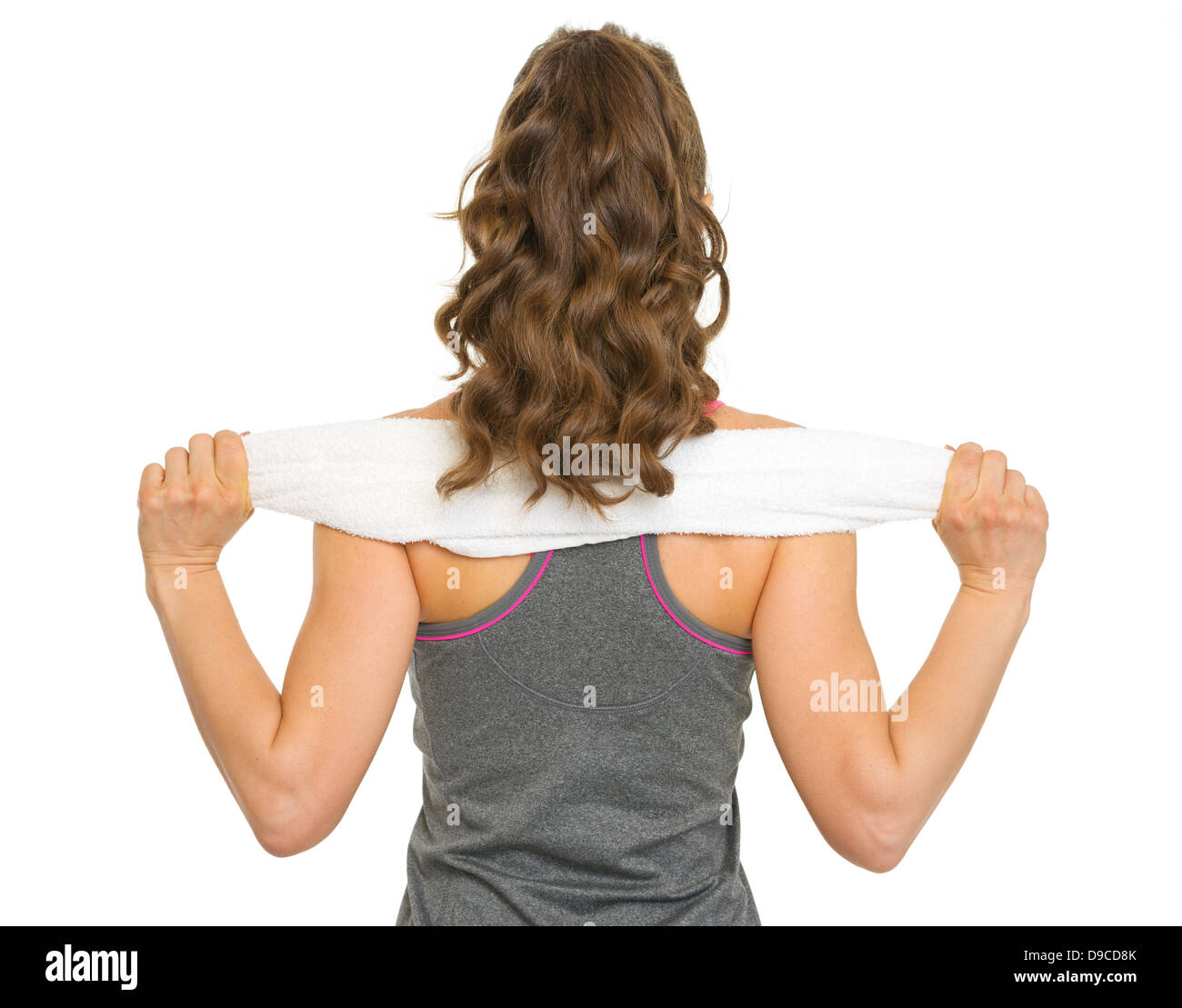 Fitness young woman with towel. rear view Stock Photo - Alamy