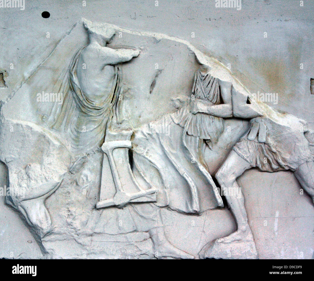 The hoplite-athlete has descended from the chariot and is standing on a ...