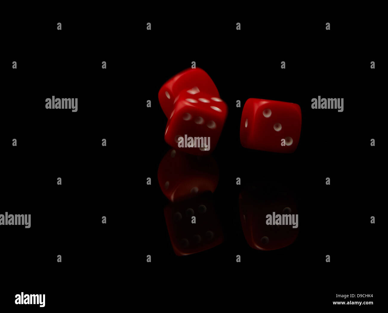 three red dice landing, on a black background with clear reflections ...
