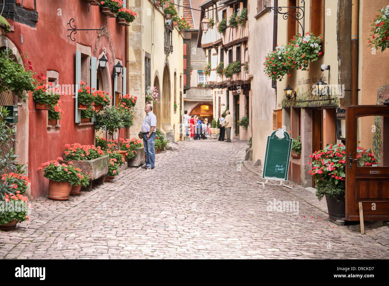 Small side lane in Riquewihr Stock Photo - Alamy
