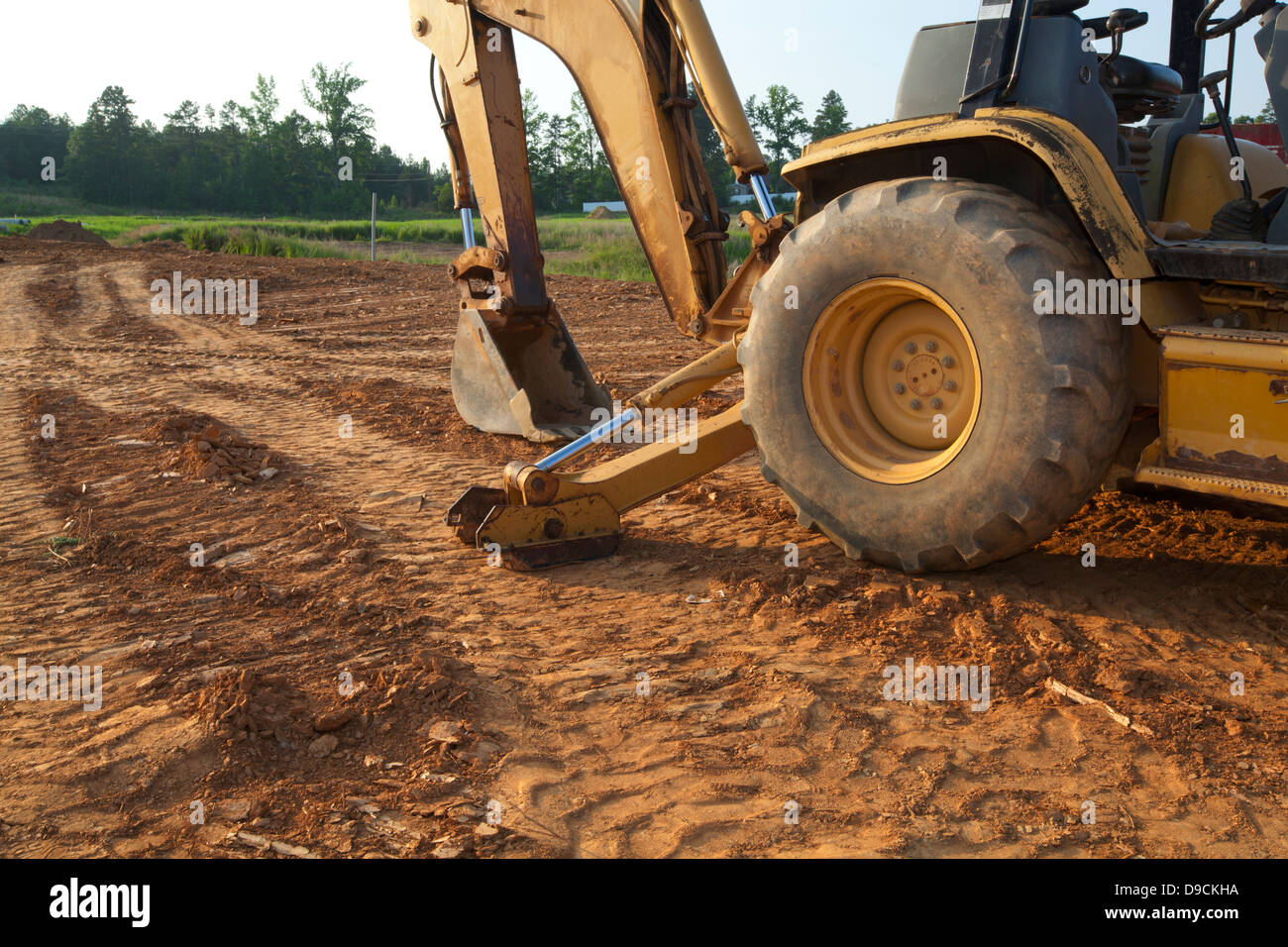 Digger at a construction site Stock Photo - Alamy