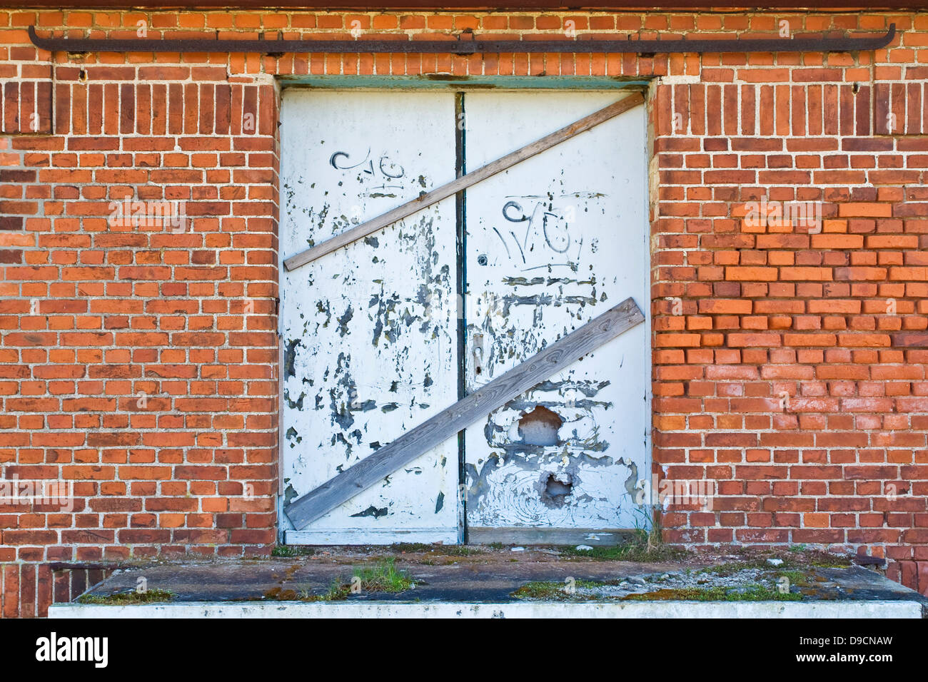 Boarded up door of a camp, Nailed up door from a warehouse Stock Photo ...