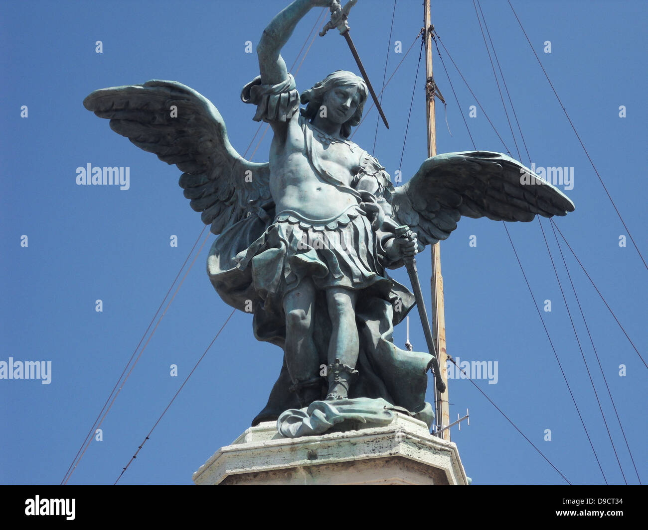 The bronze statue of Archangel Michael, standing on top of the castle ...