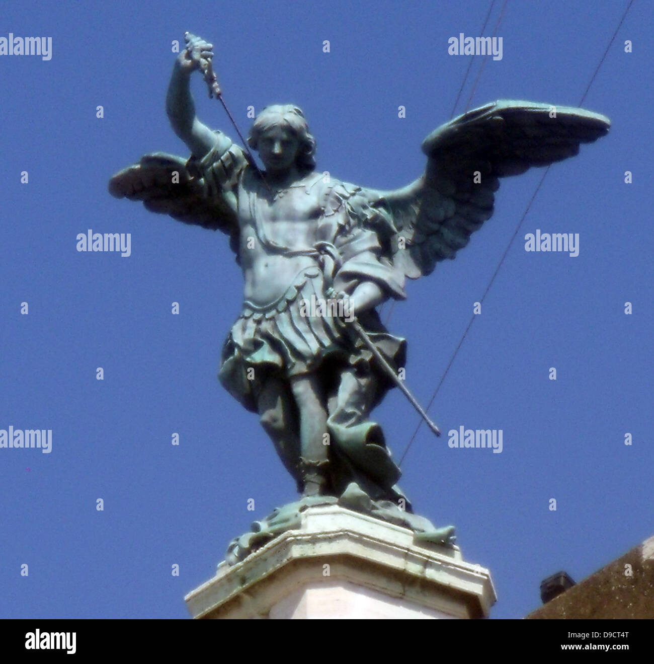 The bronze statue of Archangel Michael, standing on top of the castle ...
