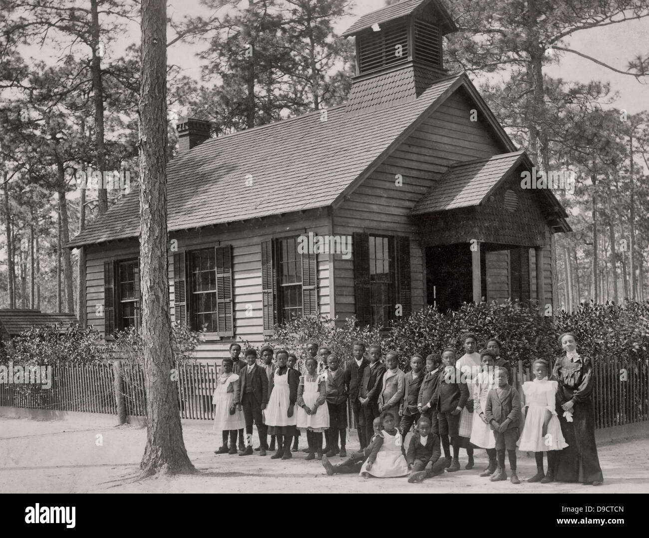 African American school children posed with their teacher outside a ...
