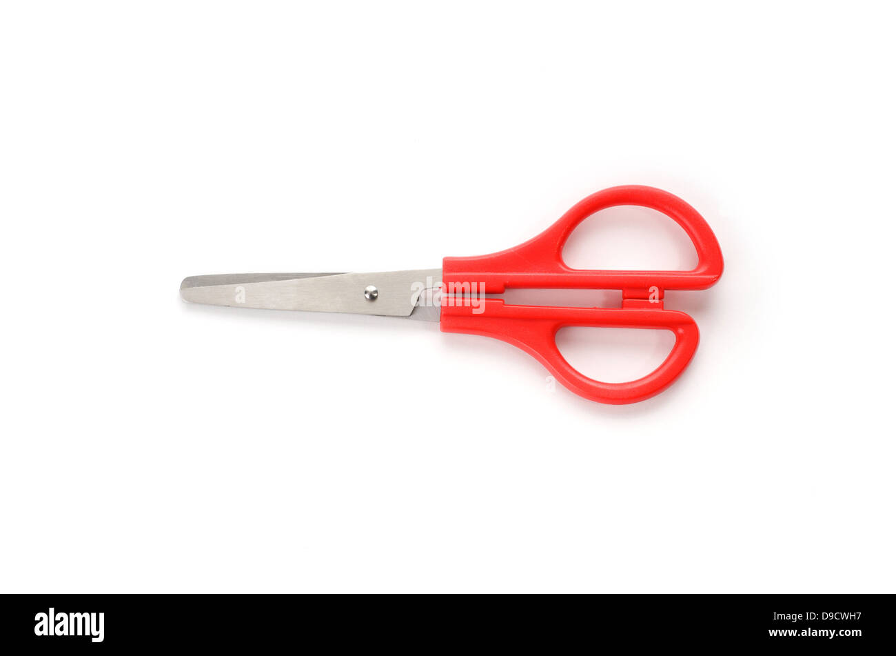 A pair of closed red scissors Stock Photo - Alamy