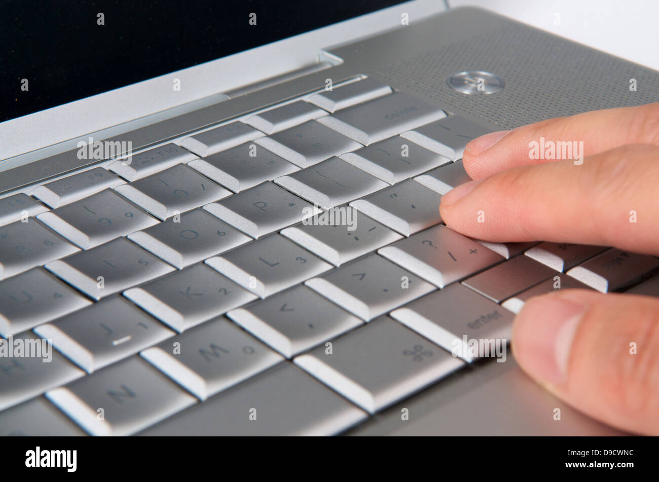 fingers pressing on laptop keyboard Stock Photo - Alamy