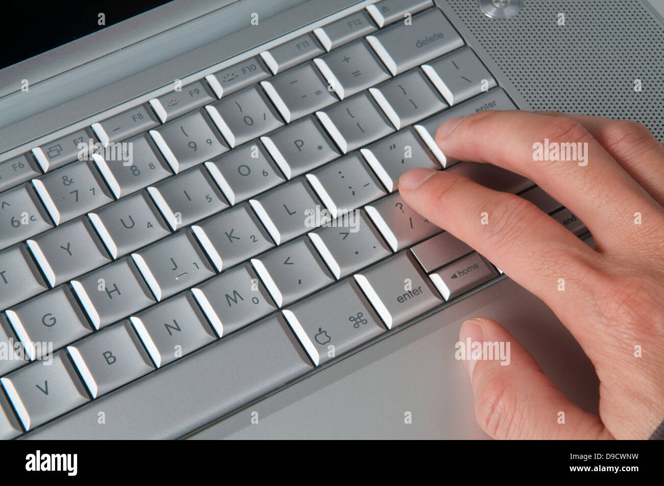 fingers pressing on laptop keyboard Stock Photo - Alamy