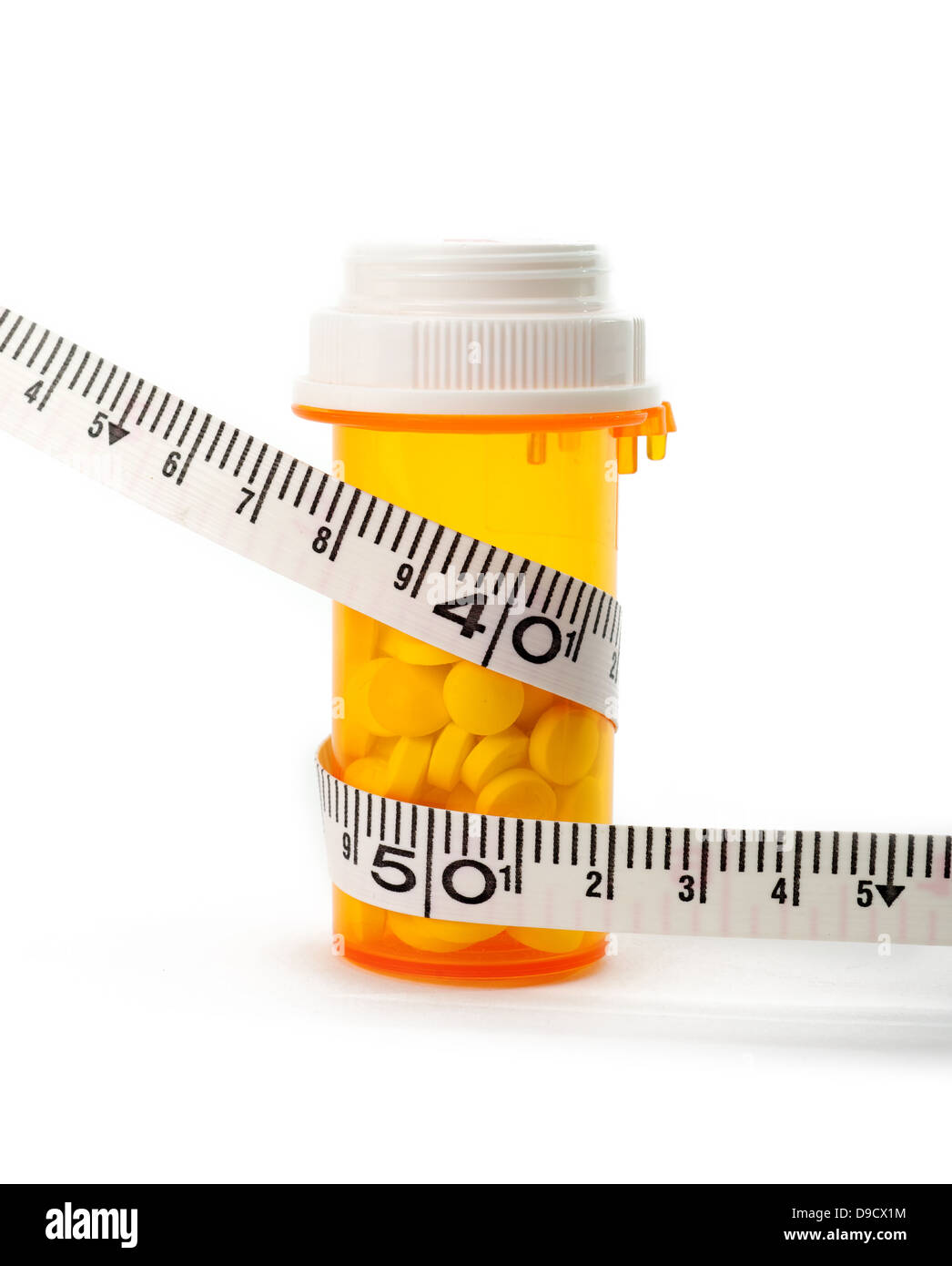 Diet pill concept using measure tape around pill bottle Stock Photo - Alamy