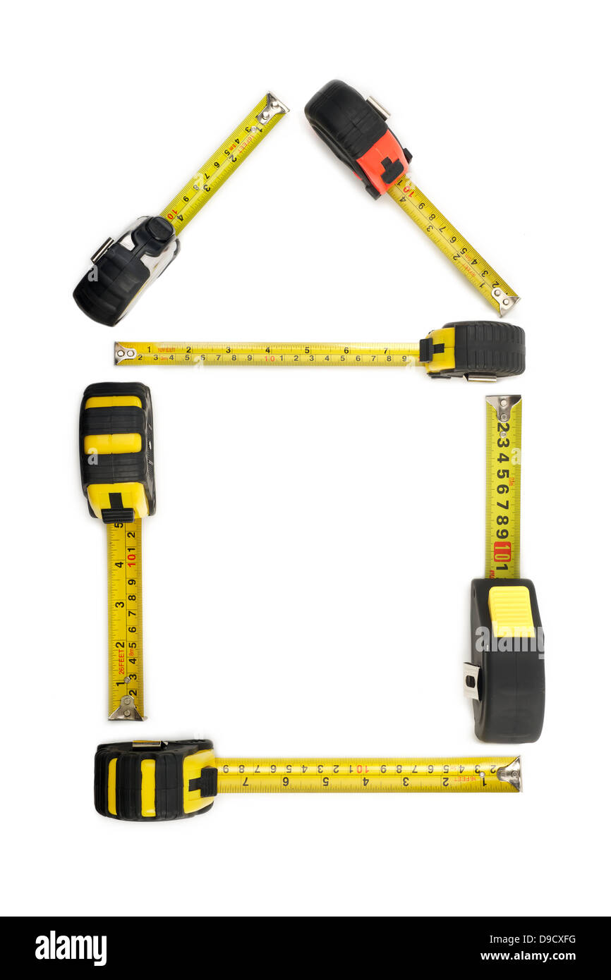 Using measure tapes to build a house shape Stock Photo - Alamy