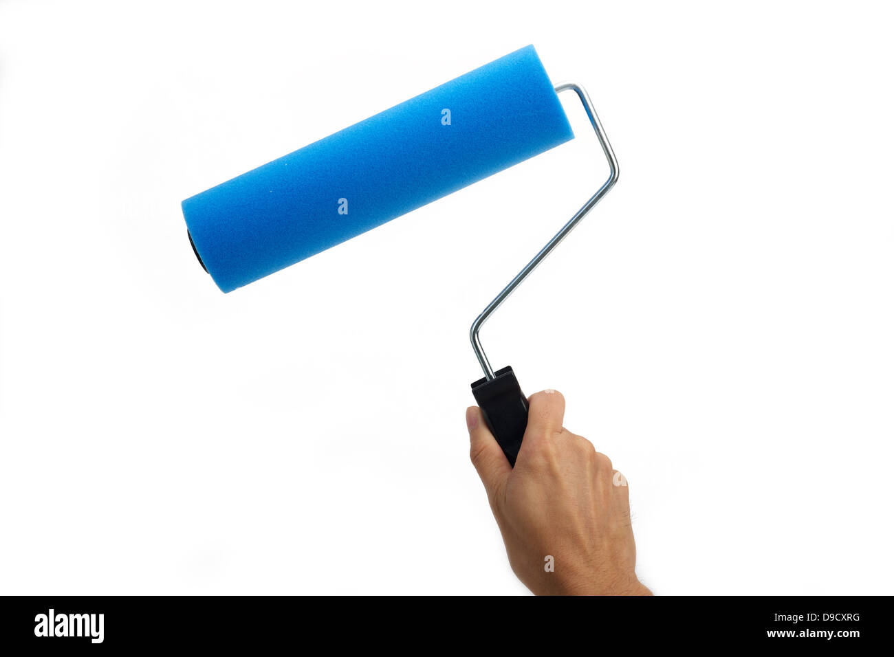 Hand holding a blue paint roller on white background Stock Photo - Alamy