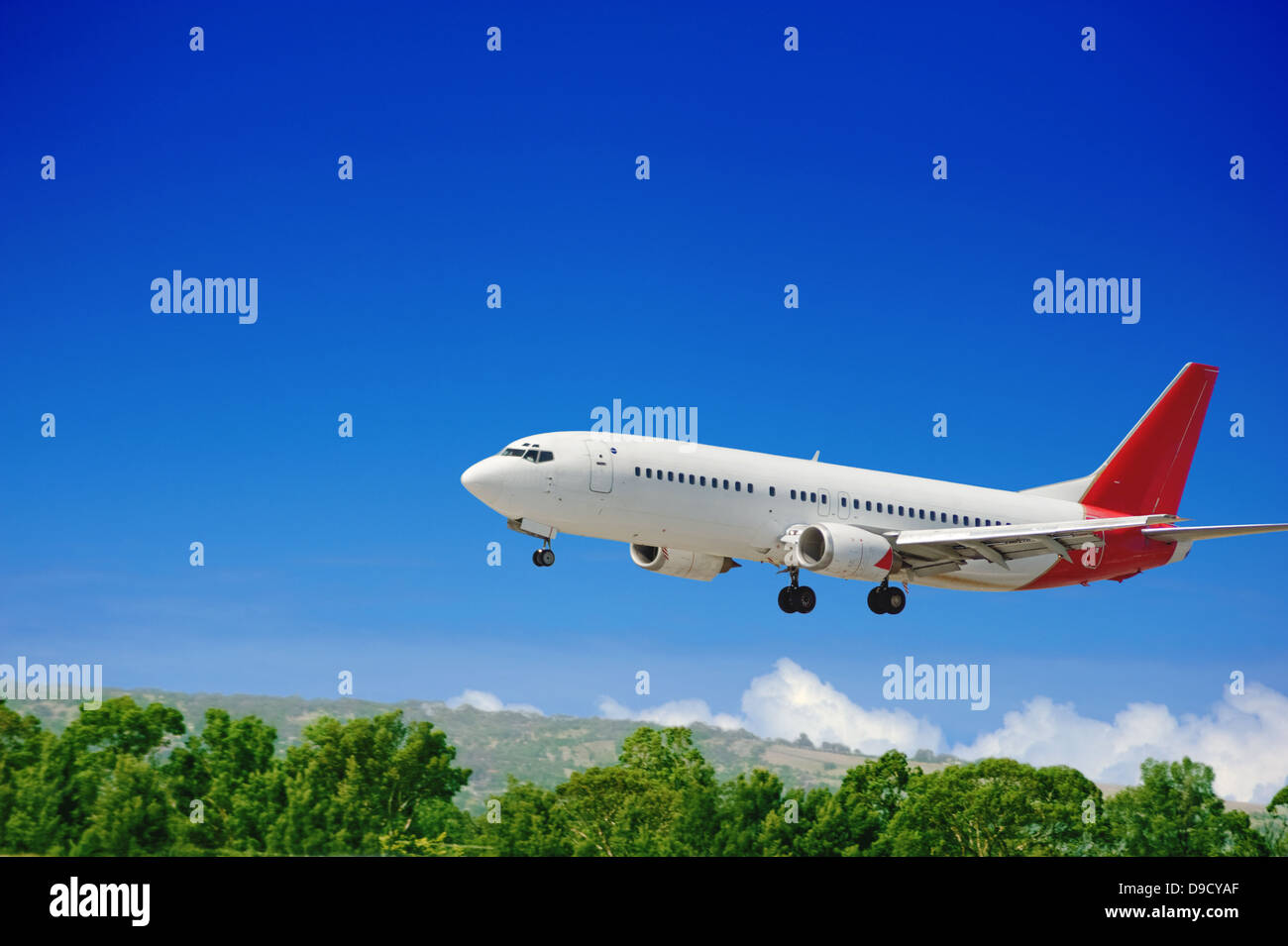 Large jet passenger airplane approaching for landing Stock Photo - Alamy