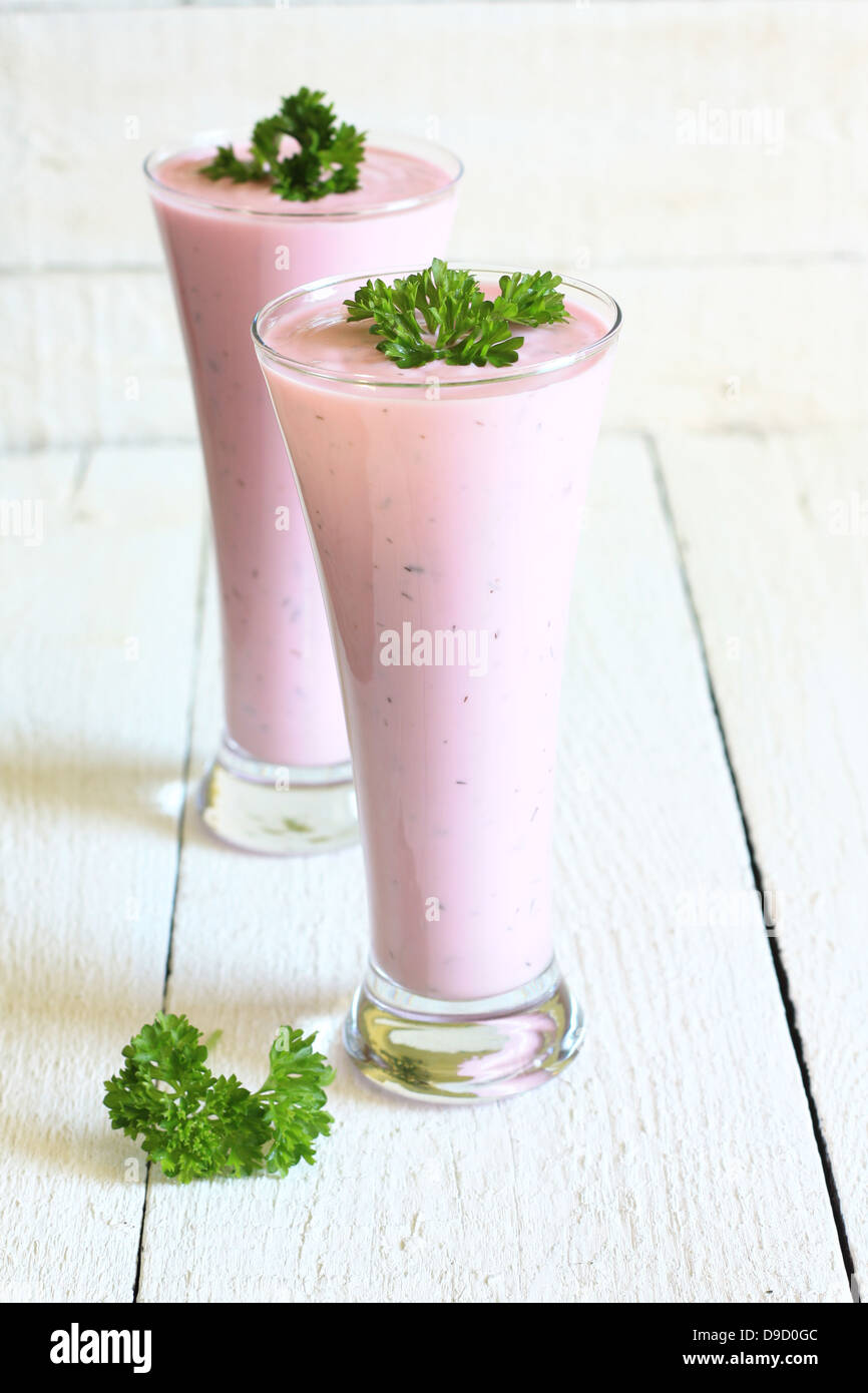 Glass of kefir with chilled beet on white planks Stock Photo - Alamy