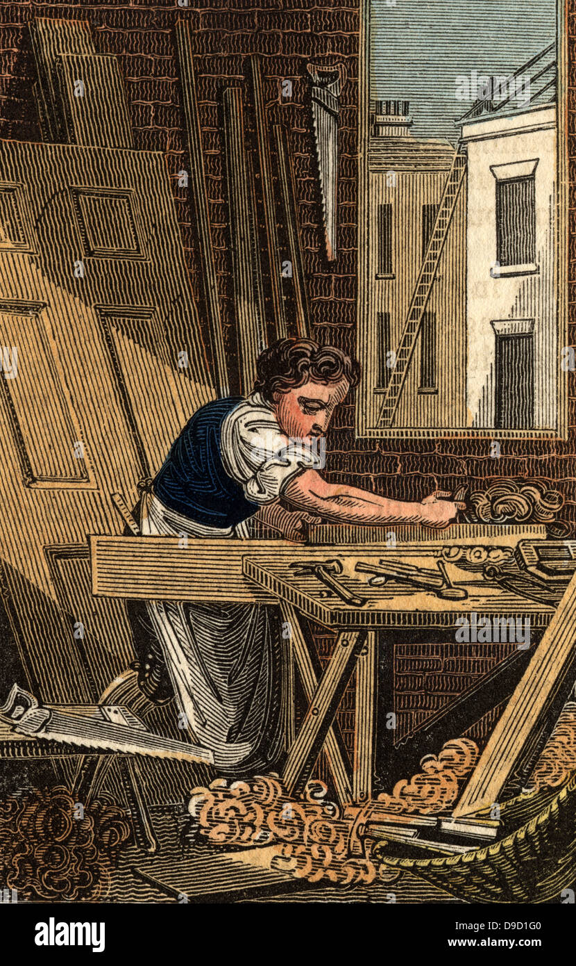 Ther Carpenter planing a piece of wood for use in the building being ...