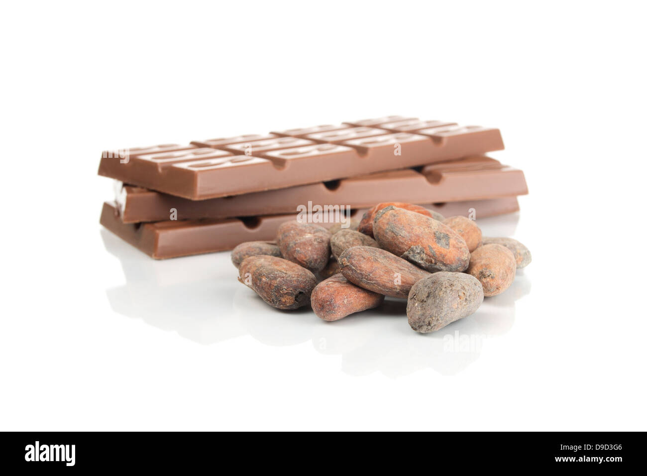 Milk chocolate with cacao beans Stock Photo - Alamy