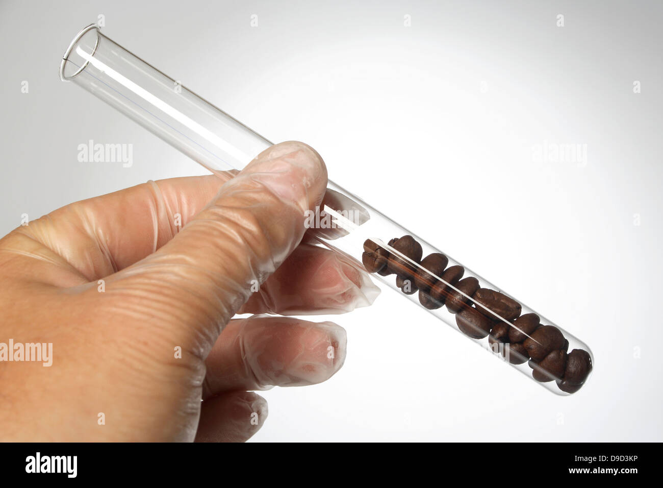 Coffee beans in the test tube Stock Photo - Alamy