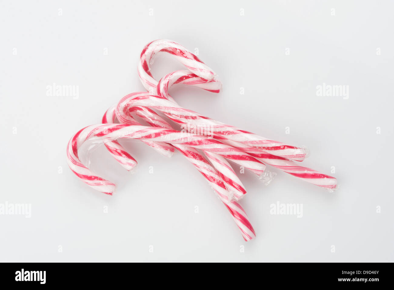 Candy canes on white background, close up Stock Photo - Alamy
