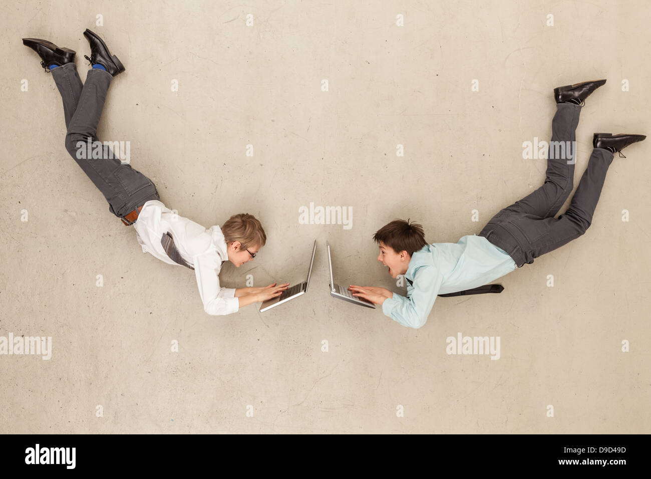 Business boys using laptop Stock Photo - Alamy