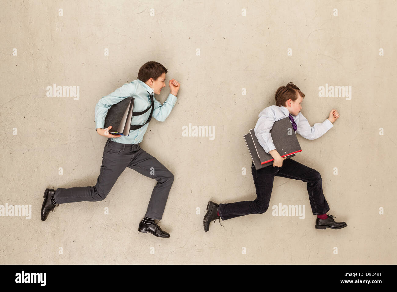 Business boys running in office Stock Photo - Alamy