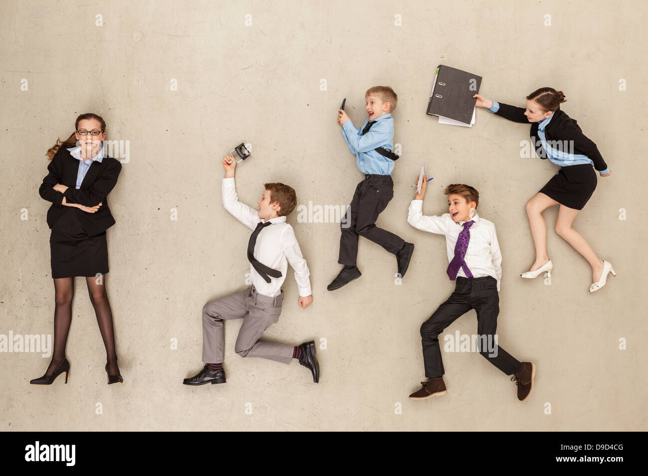 Business kids against beige background Stock Photo - Alamy