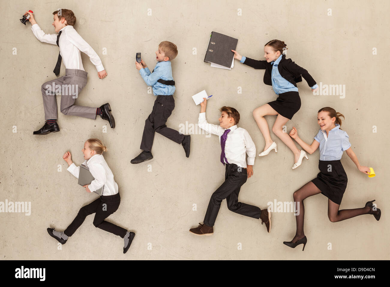 Business kids running in office Stock Photo - Alamy