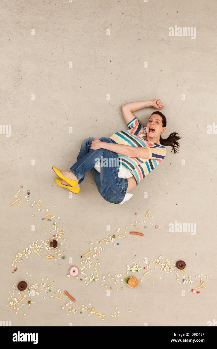 Woman falling above food Stock Photo - Alamy