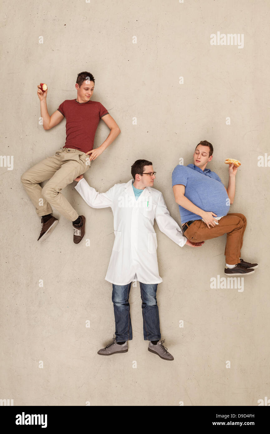 Man holding men in hands Stock Photo - Alamy