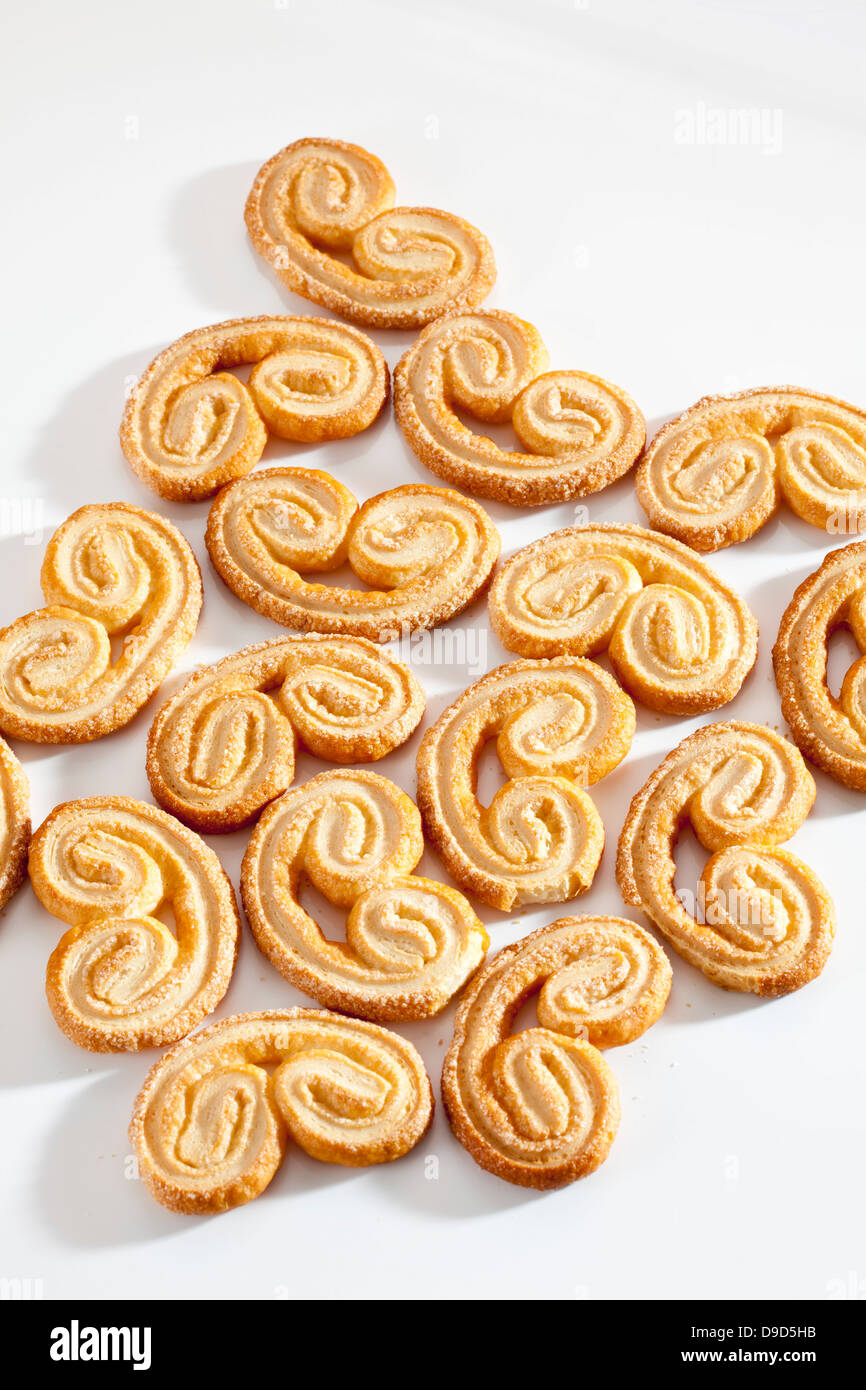 Pigs ears pastries on white background, close up Stock Photo - Alamy