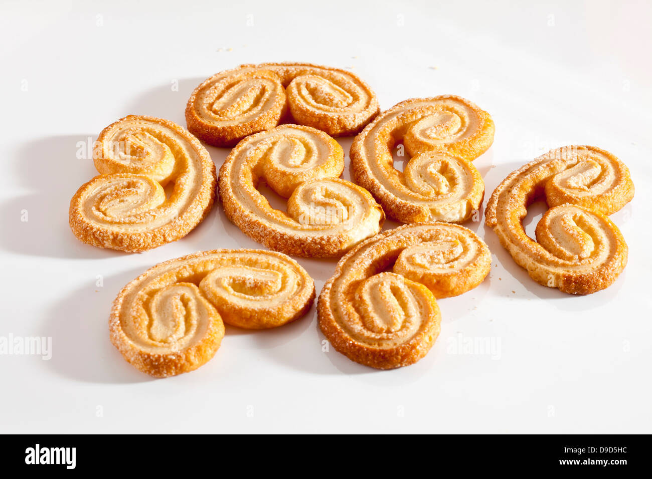 Pigs ears pastries on white background, close up Stock Photo - Alamy