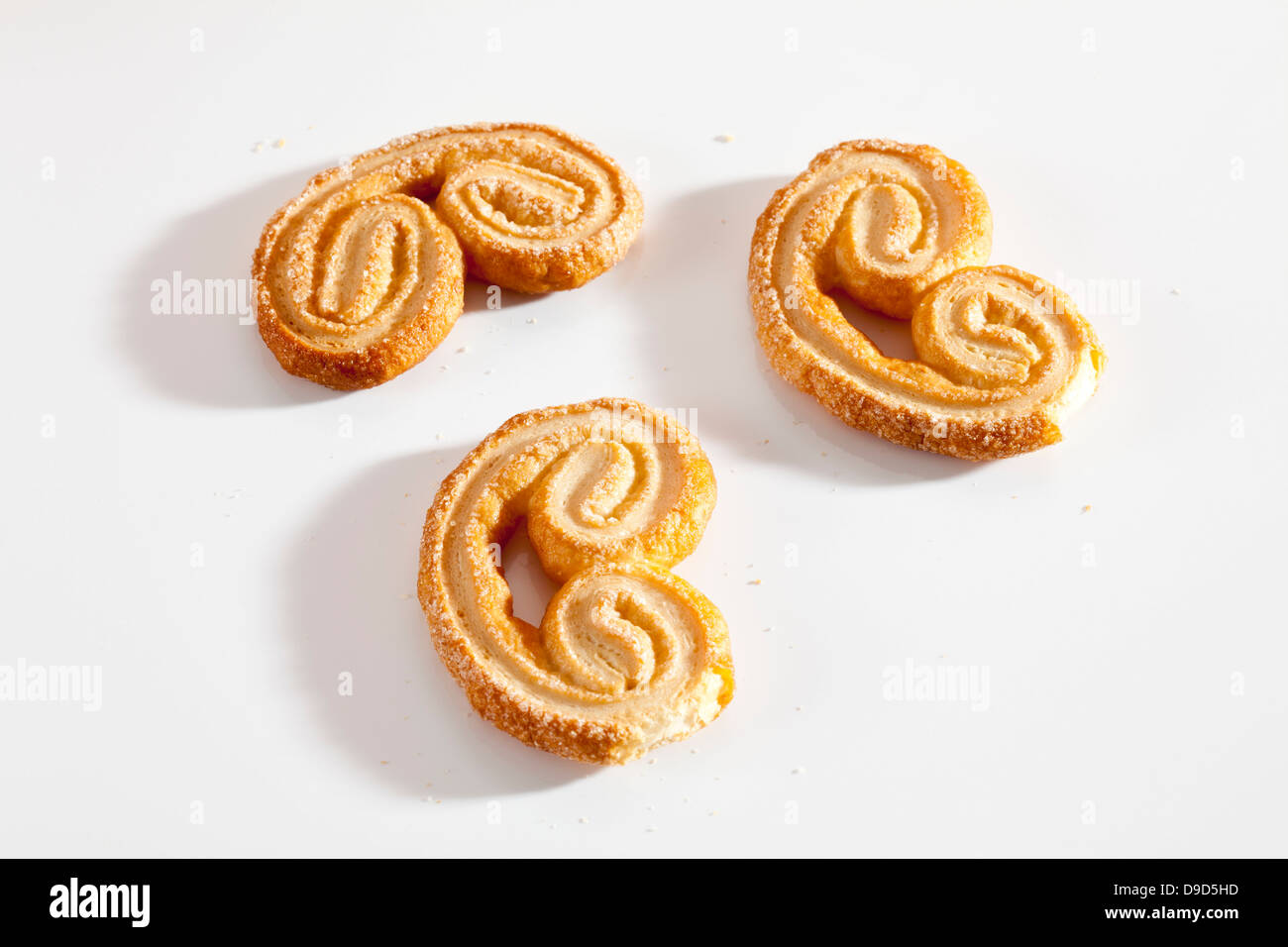 Pigs ears pastries on white background, close up Stock Photo - Alamy