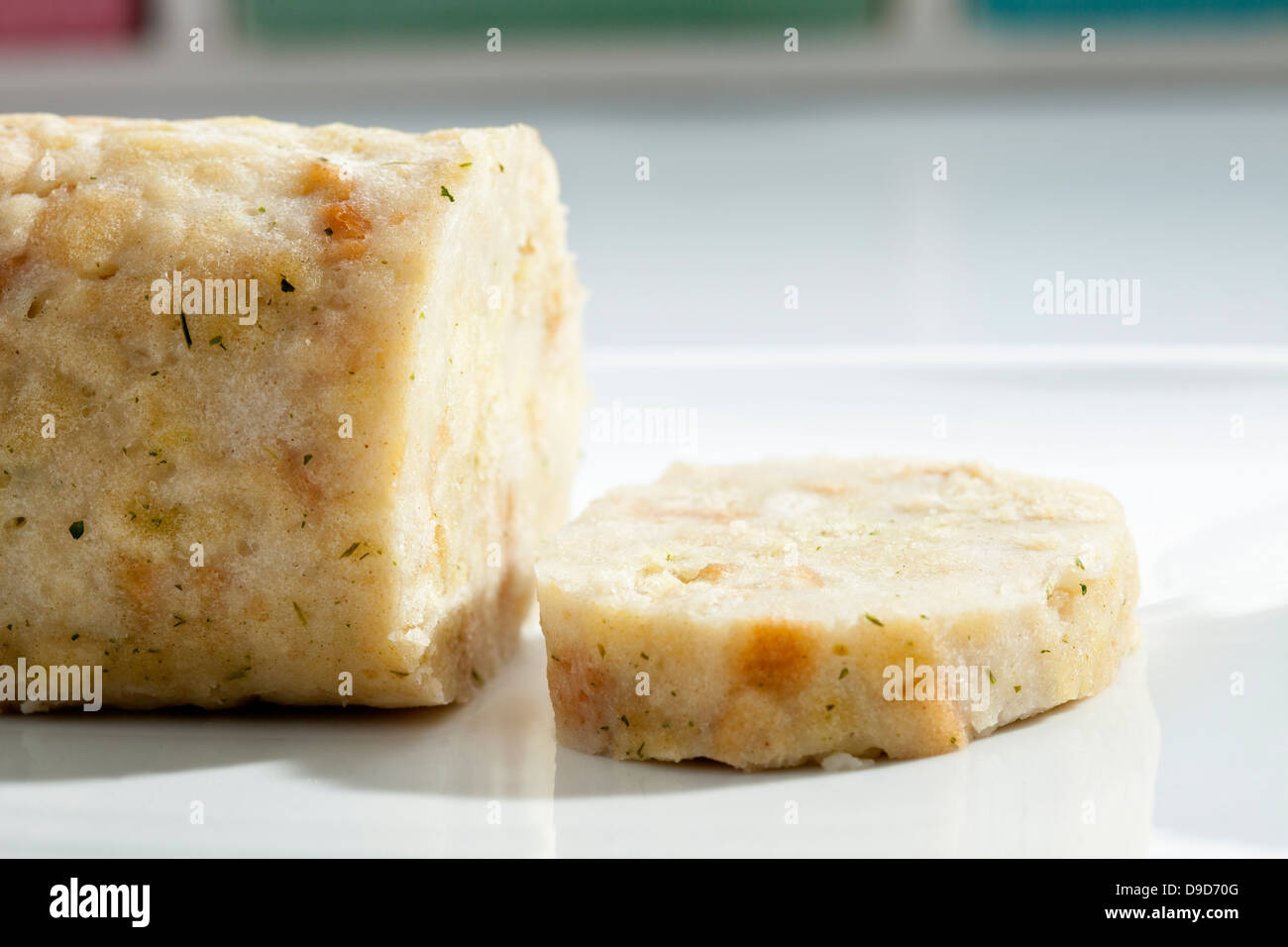 Bread dumpling roll on chopping board, close up Stock Photo - Alamy