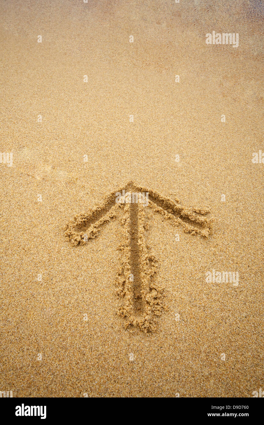 arrow on beach sand Stock Photo - Alamy