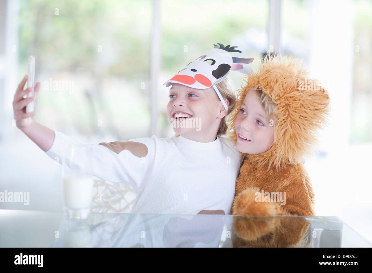 Children taking pictures of themselves with smartphone Stock Photo - Alamy