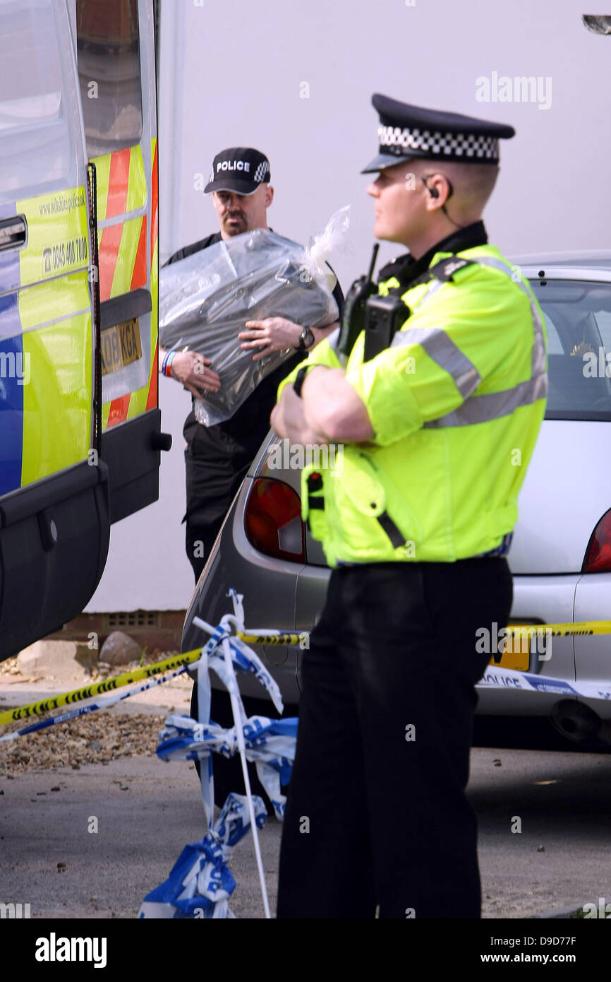 Police detectives remove evidence from a house in Swindon, allegedly ...
