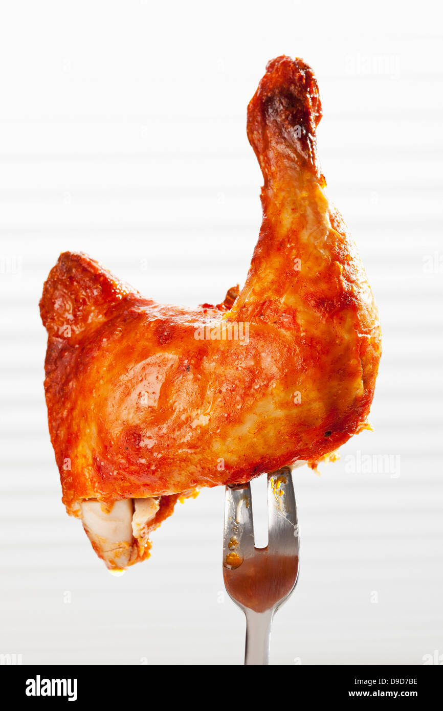Half roasted chicken on fork hi-res stock photography and images - Alamy