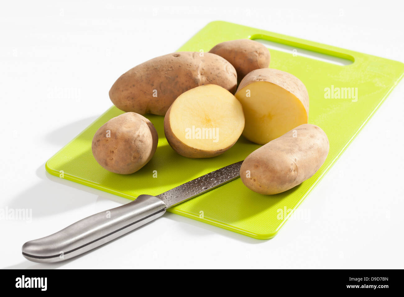 Chopping board potato Cut Out Stock Images & Pictures - Alamy