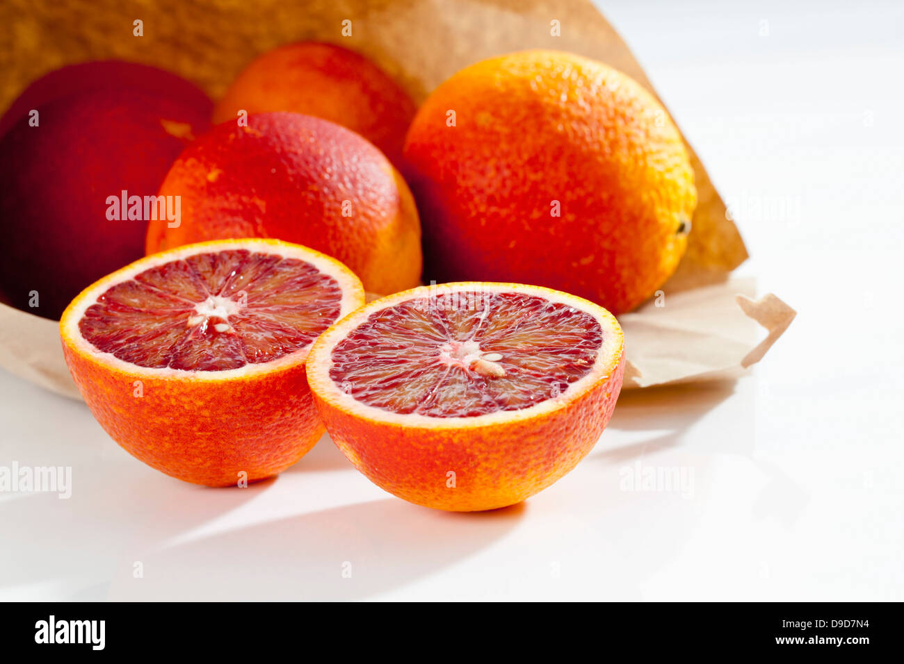 Blood oranges in paper bag on white background, close up Stock Photo ...