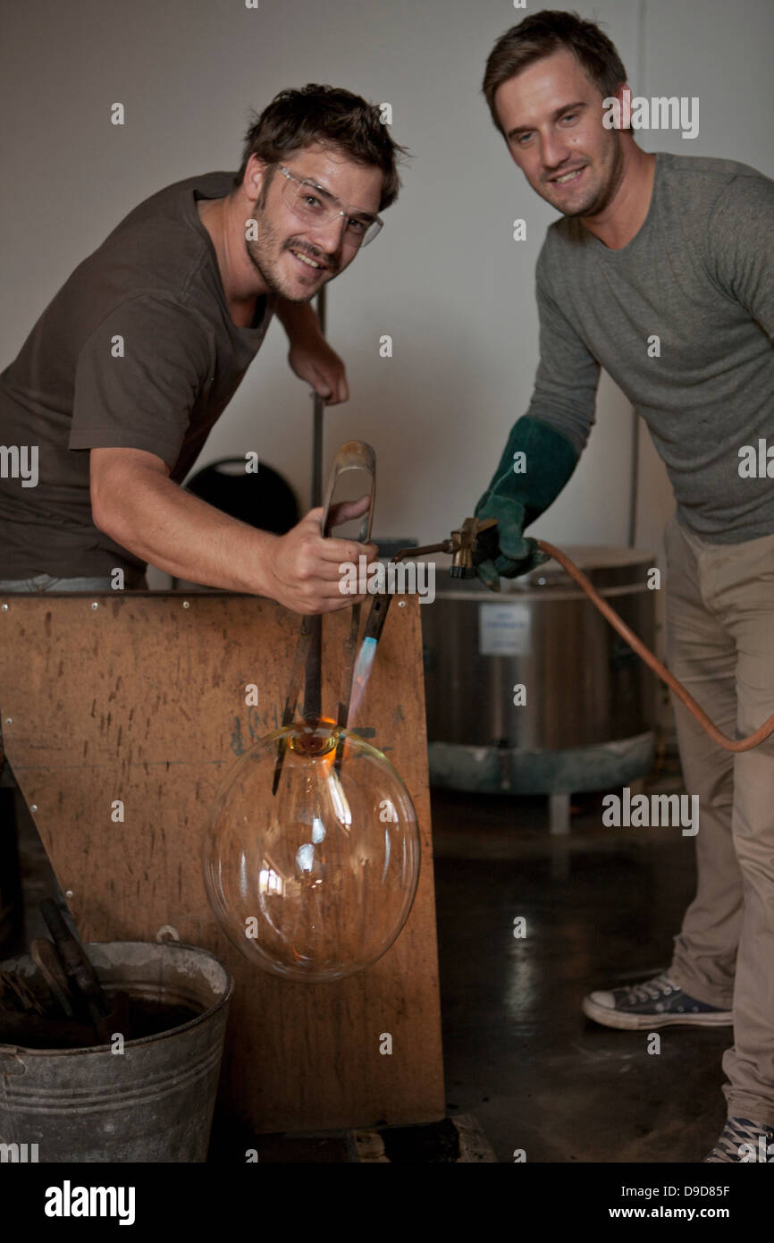 Two men blowing glass Stock Photo - Alamy