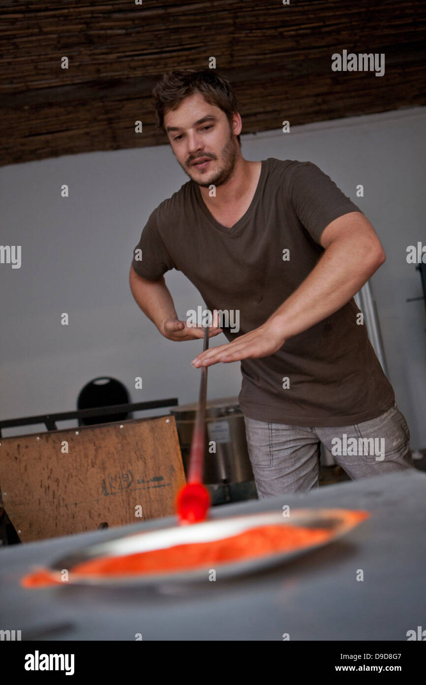 Man working in glass factory Stock Photo - Alamy