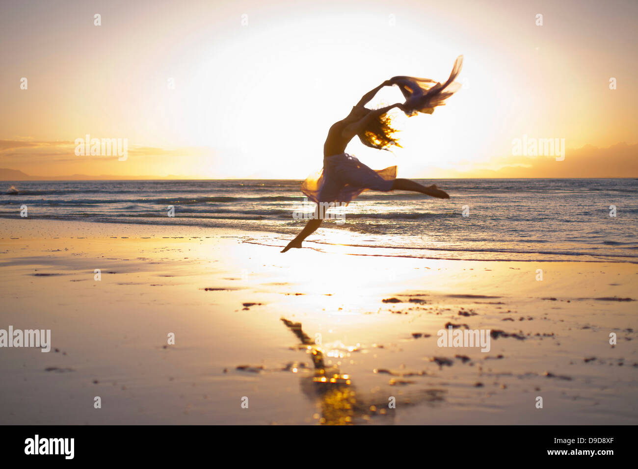 Woman dancing on the beach hi-res stock photography and images - Alamy