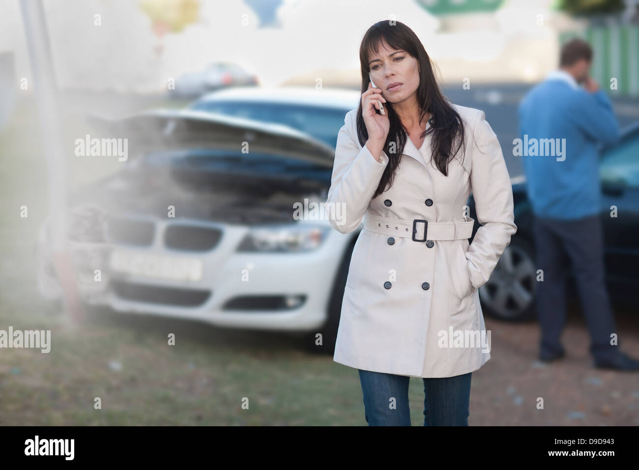 Woman on mobile phone after car accident Stock Photo - Alamy