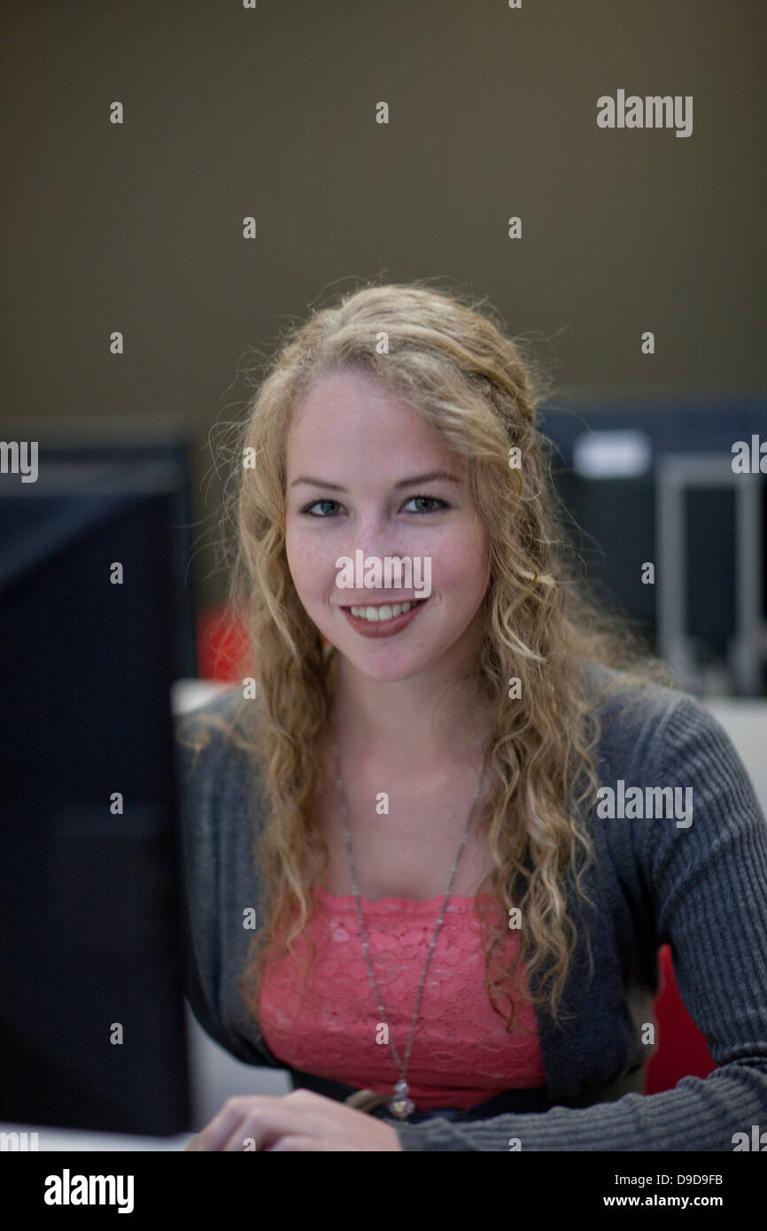 Female student using computer in class Stock Photo - Alamy