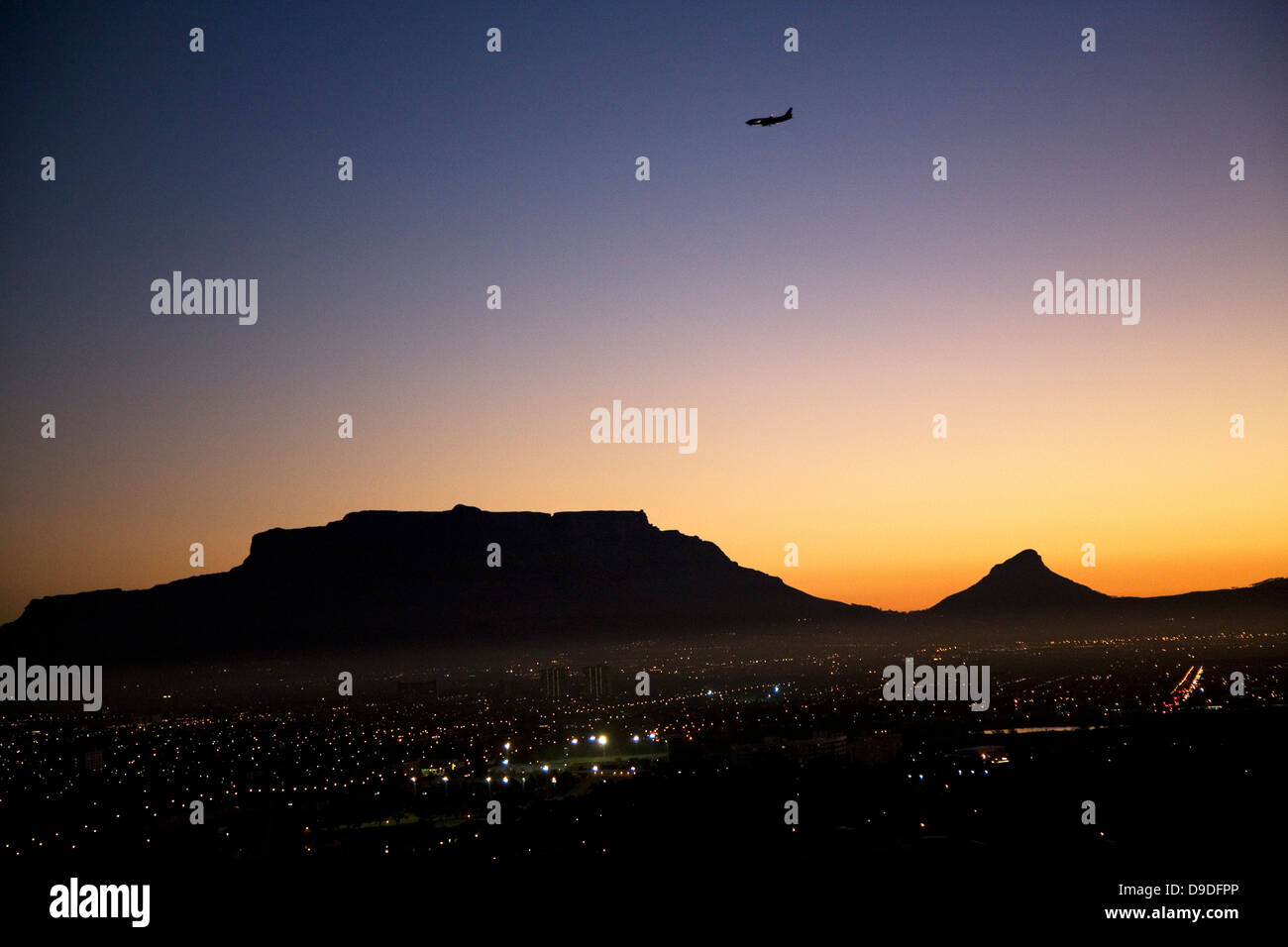An aeroplane descends toward Cape Town International Airport as last ...