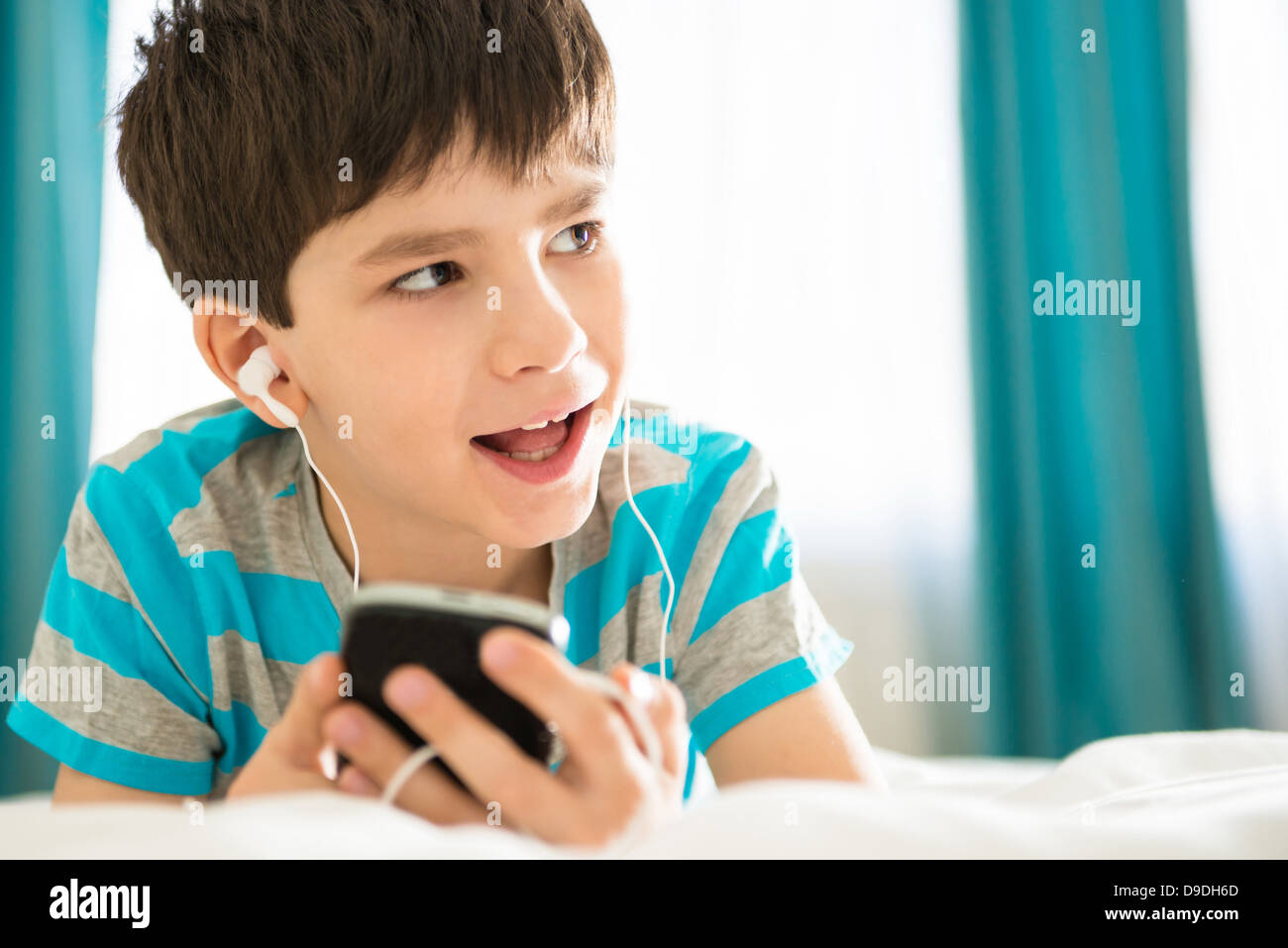 Boy smiling listening music hi-res stock photography and images - Alamy