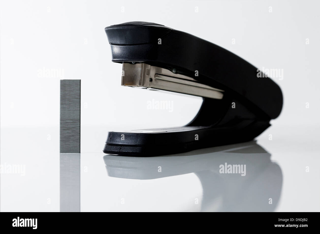 Anthopomorphic stapler and staples Stock Photo - Alamy