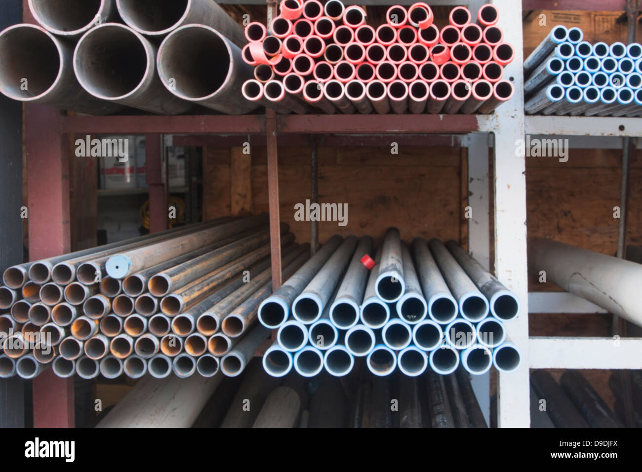 Construction piping on shelves Stock Photo - Alamy