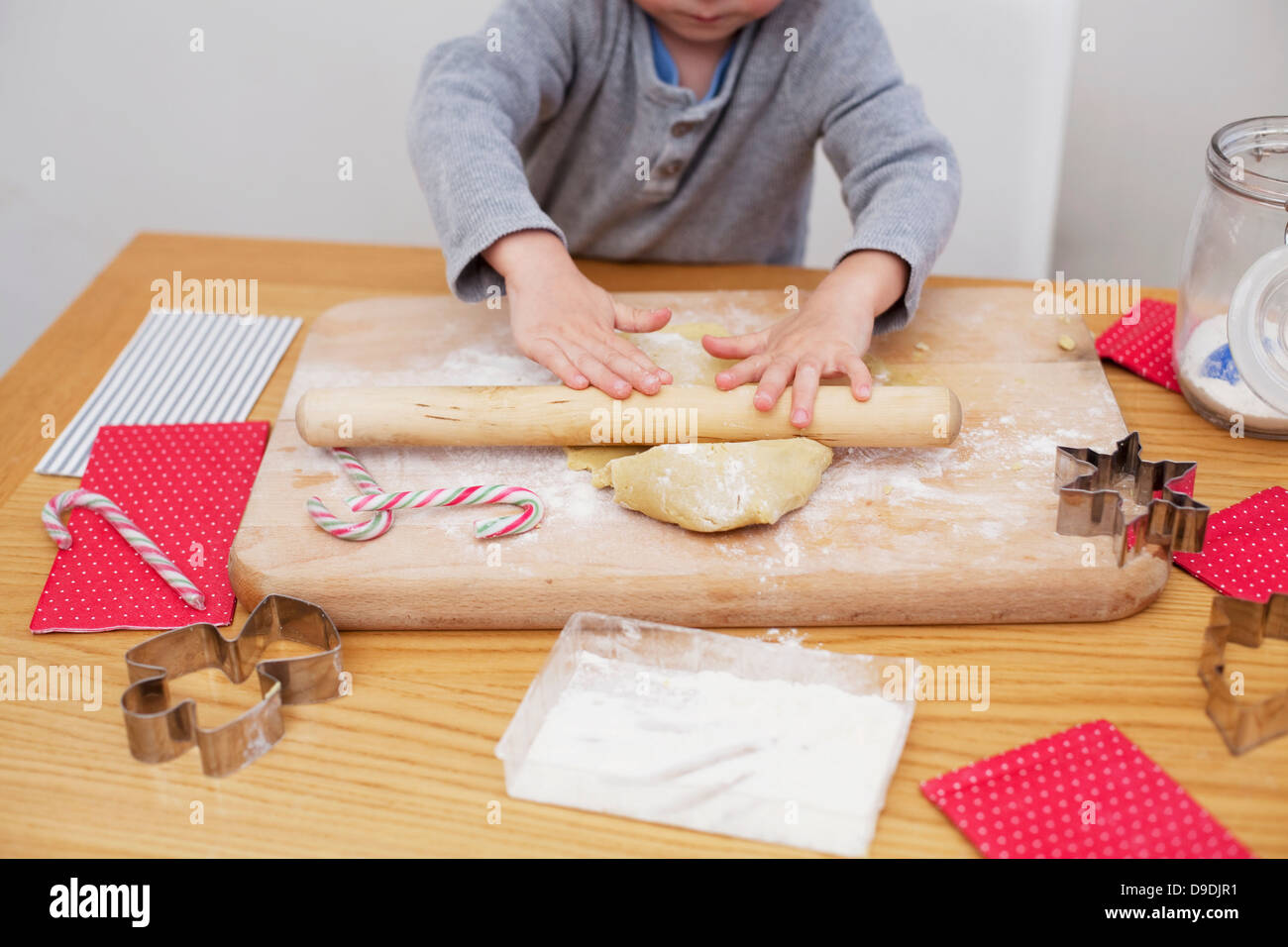 Boy rolling cookie dough, baking Christmas biscuits Stock Photo - Alamy